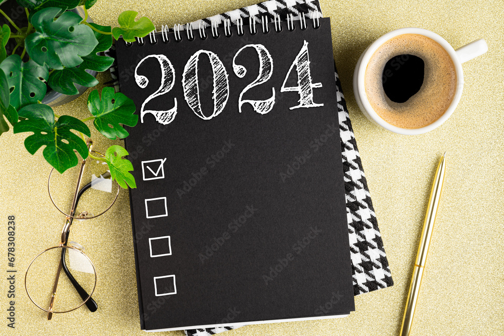 New year resolutions 2024 on desk. 2024 resolutions list with notebook ...