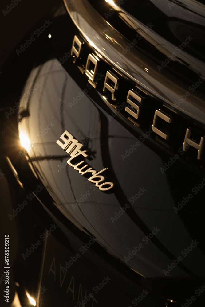 Porsche 911 992 rear end model badge, close up view, sun shine reflex ...