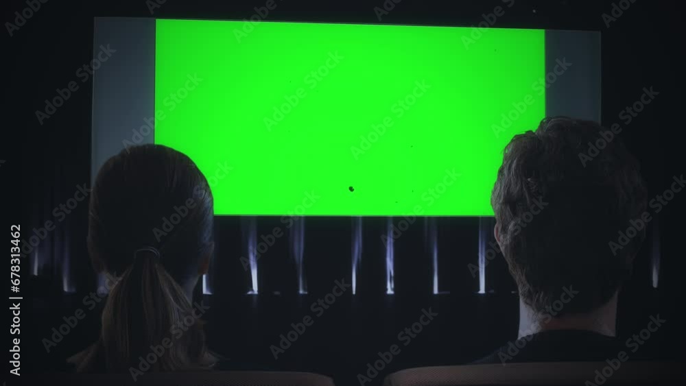 Video „Green Screen Cinema Couple Watching Movie Theater Zoom In ...