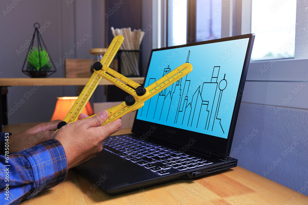 Architecture is designing building structure on laptop computer on desk ...