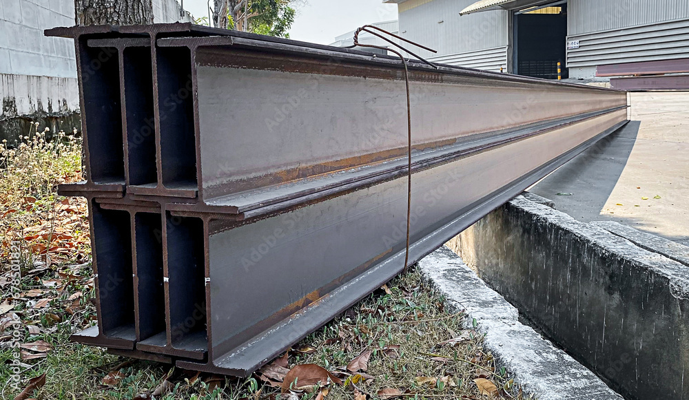 Steel beams production. Metal girders stack on project construction ...