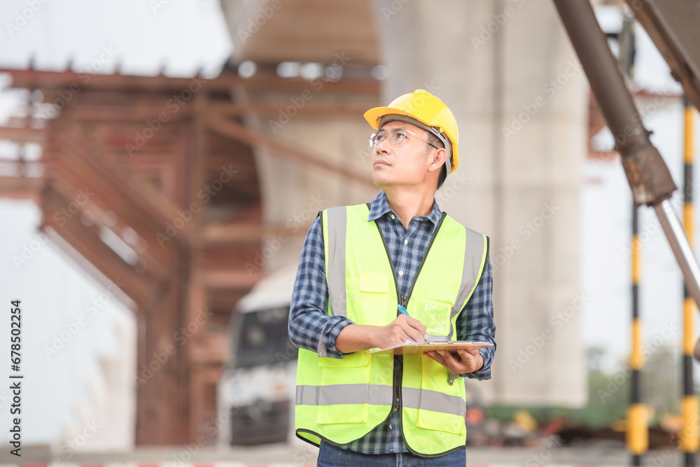 Engineer man with clipboard checklist in construction site, Industrial ...