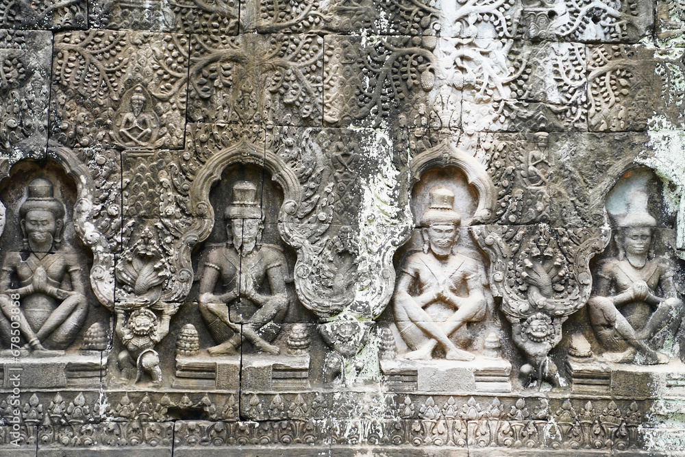 Bas relief depicting sages on a panel inside the Preah Khan templex ...