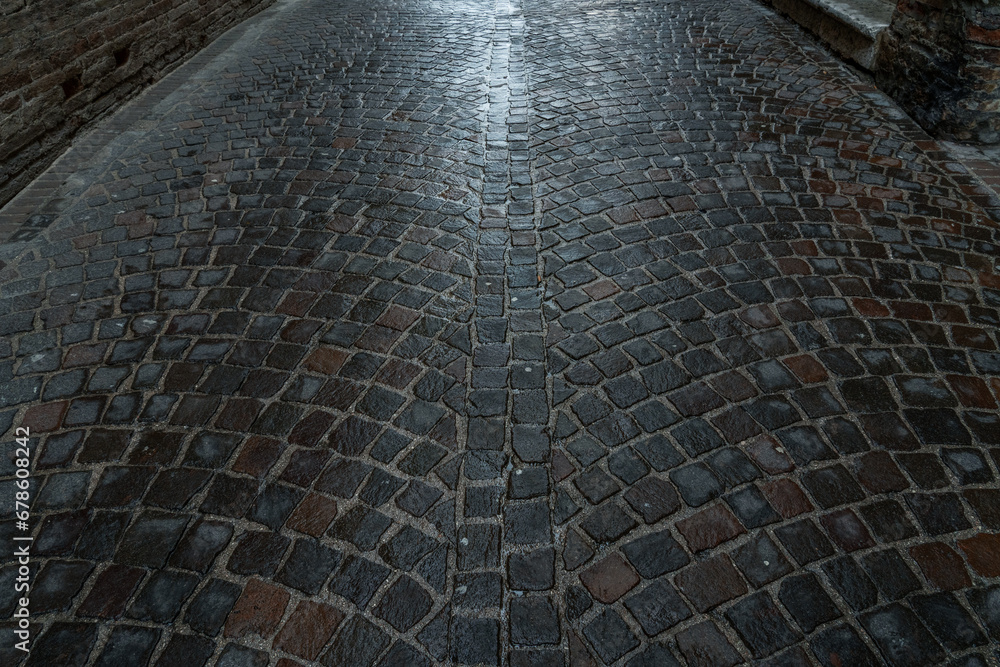 Glistening Wet Cobblestone Street. Light reflects on cobblestones of an ...