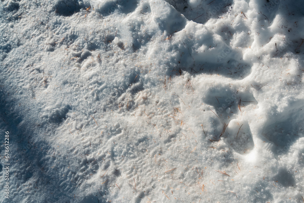 Texture of ground covered in snow. Trampled snow illuminated by the sun ...