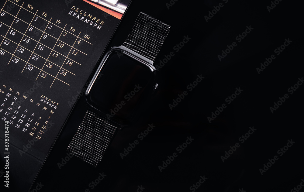 Task planning. Calendar and smart watch on a black background. Stock ...