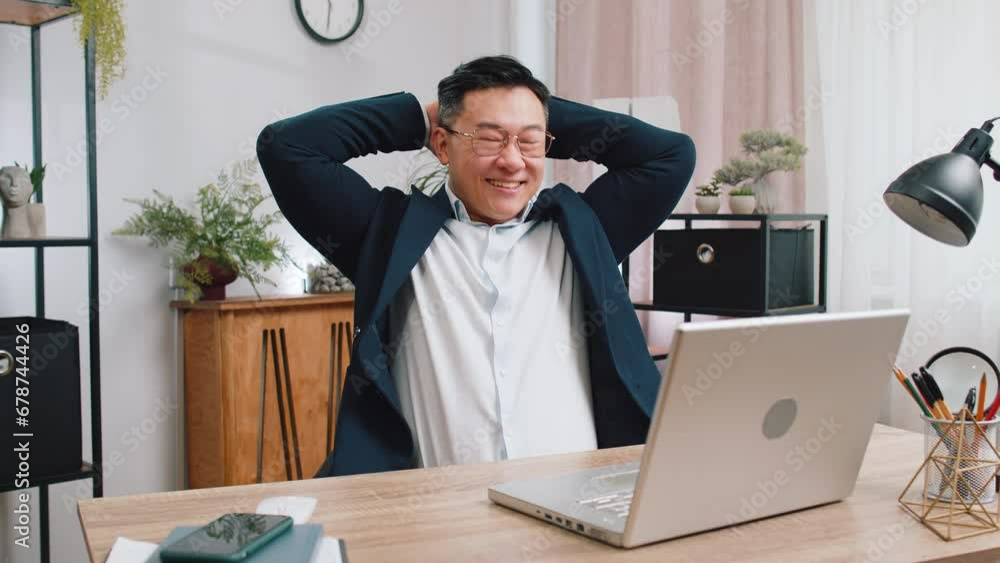 Asian businessman freelancer taking break leaning on chair after ...
