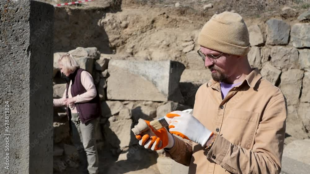 An anthropologist professor tells and demonstrates a bone found during ...