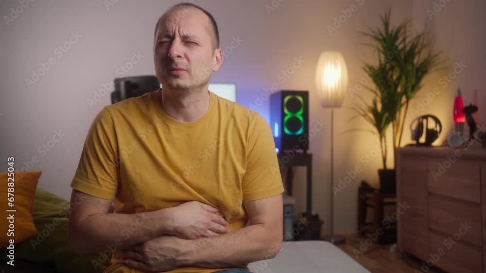 Terrible pain in the stomach. A mature man suffering from abdominal ...