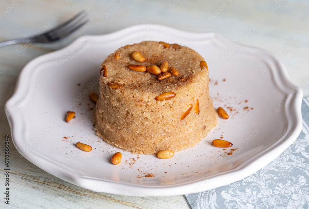 Traditional Turkish desserts; Semolina halva with orange (Turkish name ...