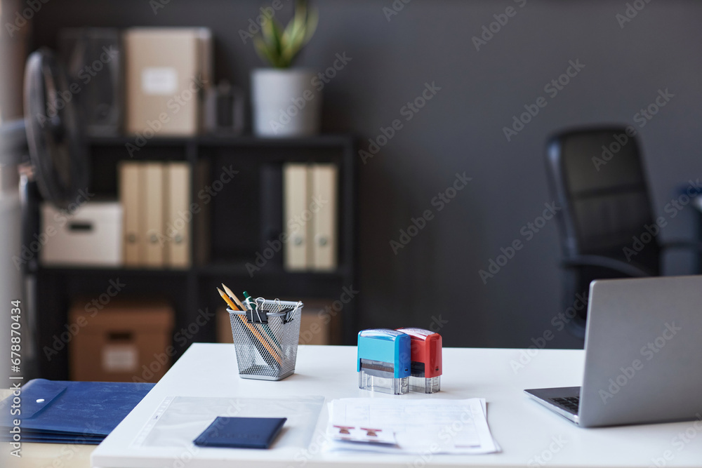 Workplace of white collar worker with laptop, stamps for documents and ...