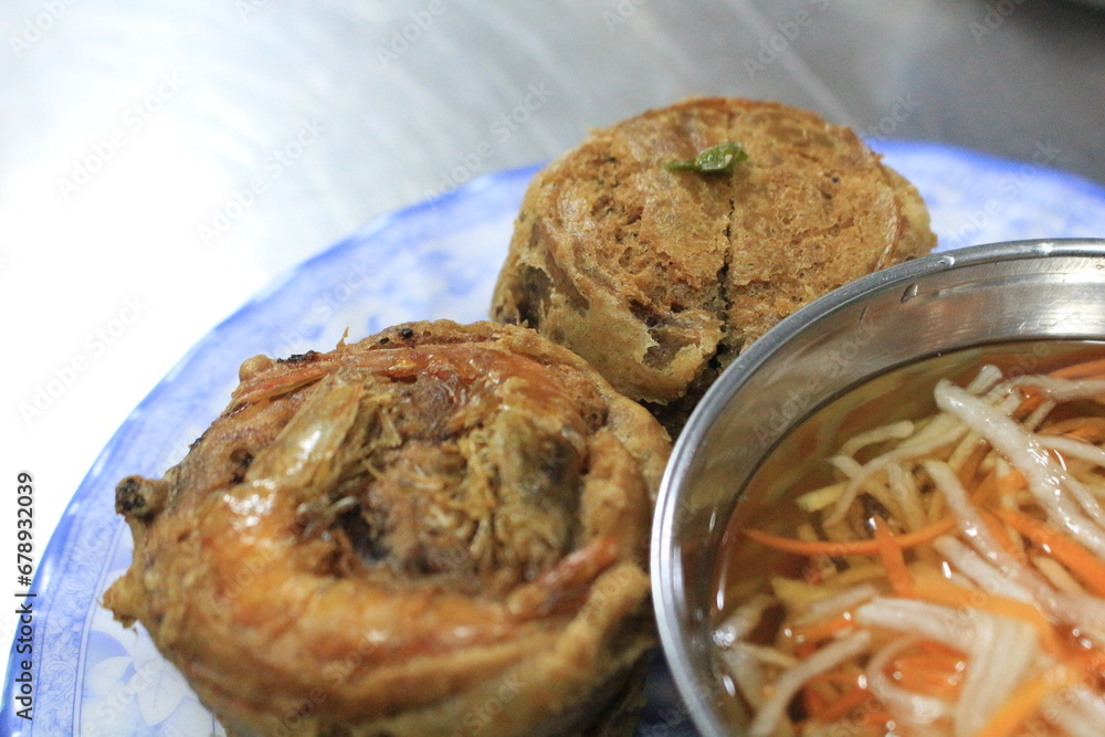Banh Cong- Viet Nam crunchy fried shrimp cake that served with lettuce ...