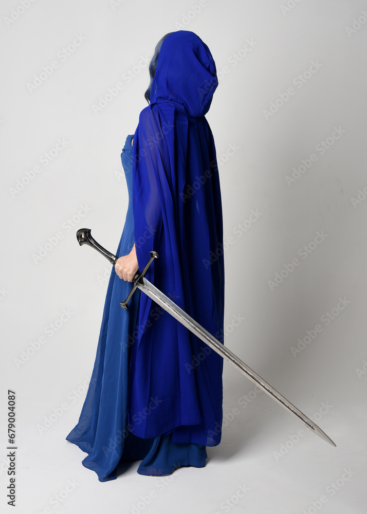 Full length portrait of beautiful female model wearing elegant fantasy ...