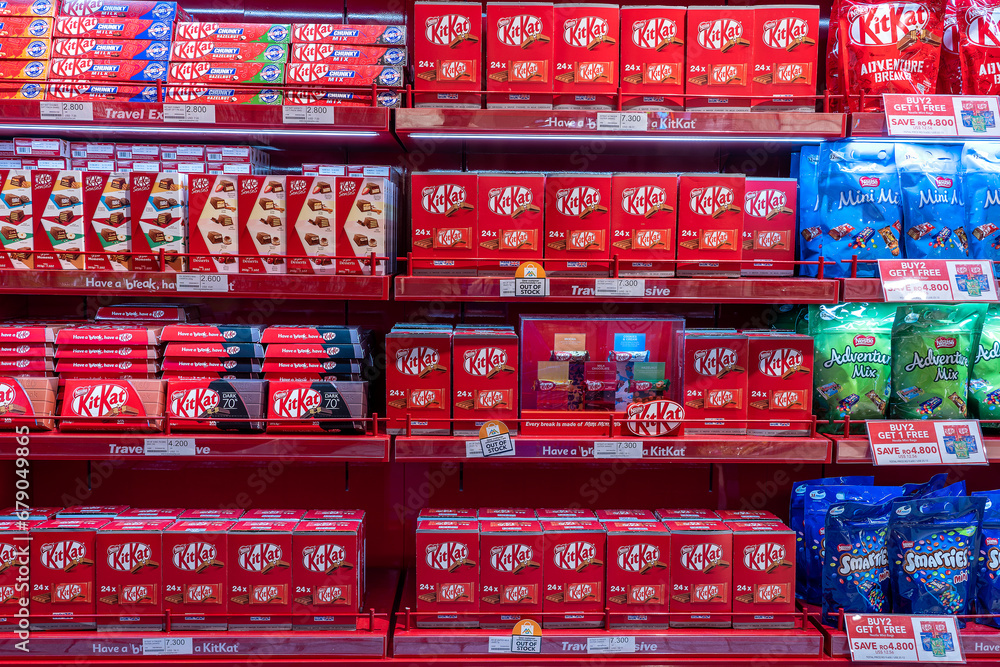 Kit Kat chocolates and other sweets on a shelf at the duty-free shop at ...