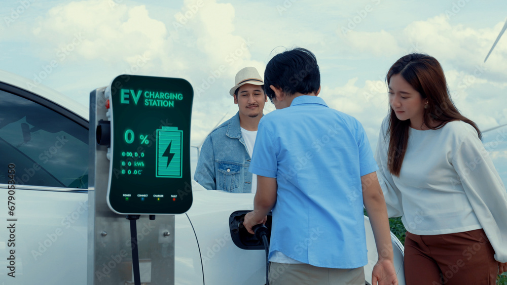 Modern family travel and nature with eco-friendly EV car concept ...