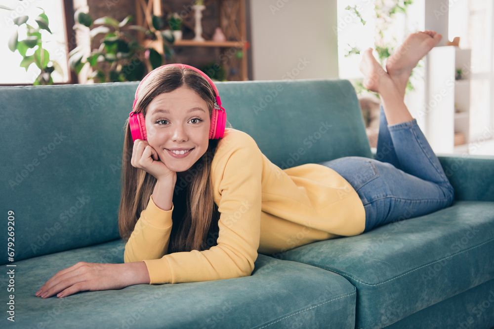 Full body size photo of chilling teenager barefoot girl lying divan and ...