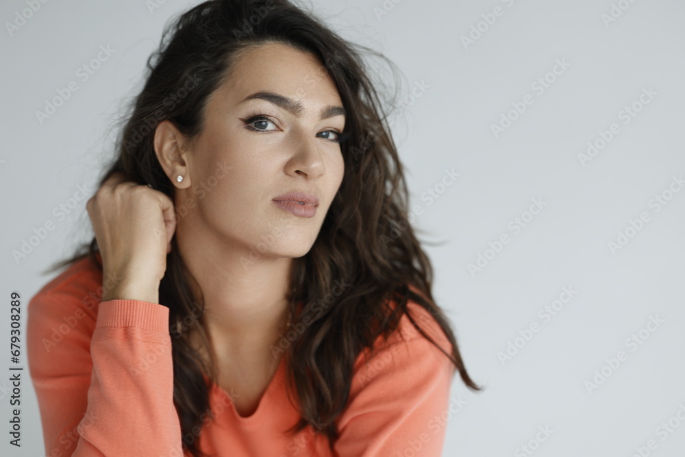 Beautiful woman of 30 years old sitting on chair, white background ...