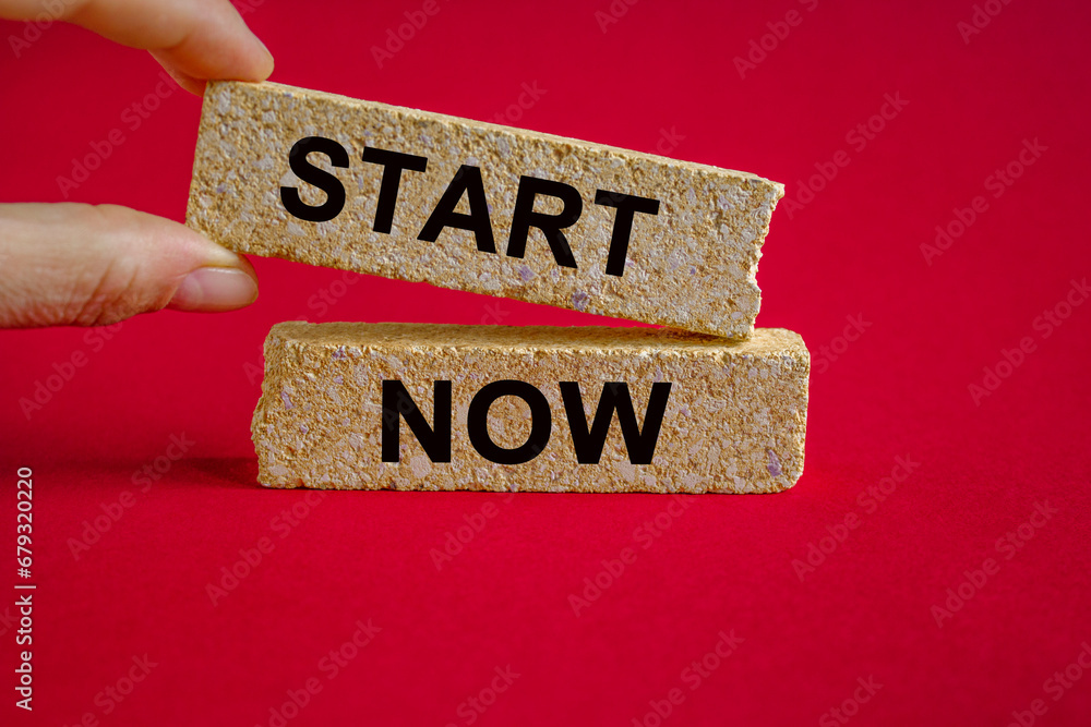 Start now symbol. Concept words Start now on beautiful brick blocks ...