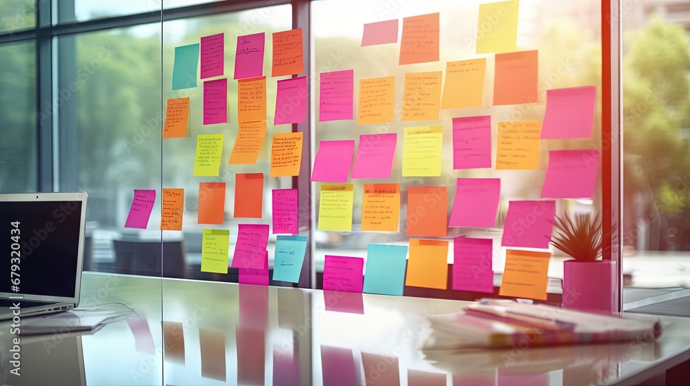 Blur color notes or sticky note on the glass wall in the office during ...