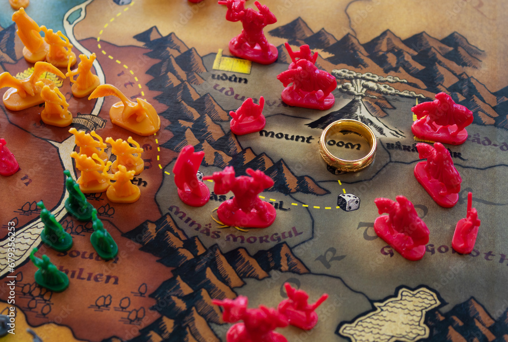 Closeup to a Ring of power over Mordor country map with orcs elfs and ...