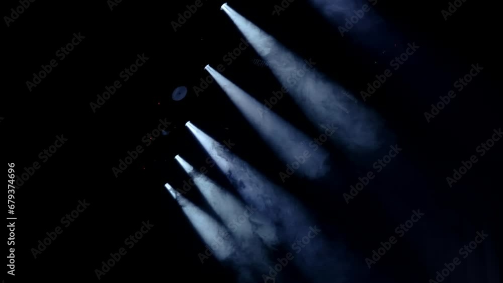 Stage lights in the studio. Stage lighting with a little smoke. Rays of ...