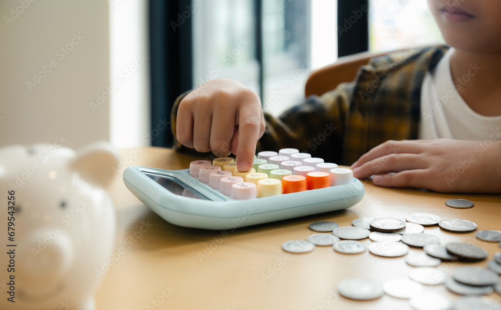 Little boy using calculator for calculations, Developing skills ...