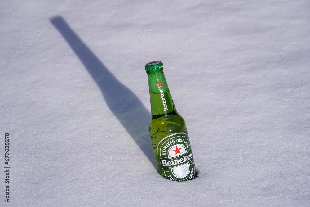Bottle of Heineken Lager Beer on a bed of snow and white background ...
