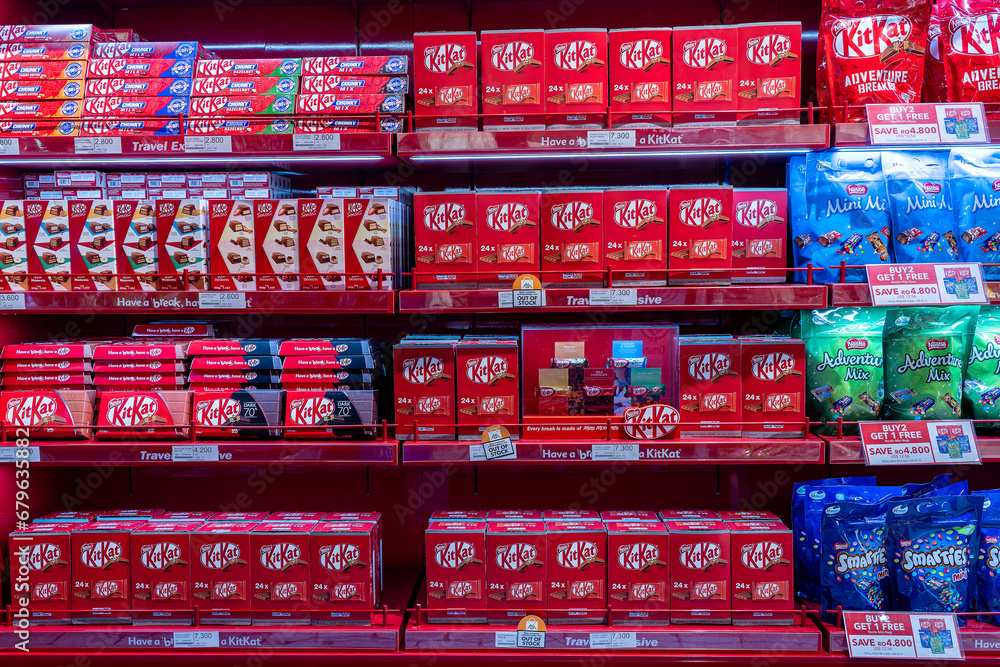 Kit Kat chocolates and other sweets on a shelf at the duty-free shop at ...