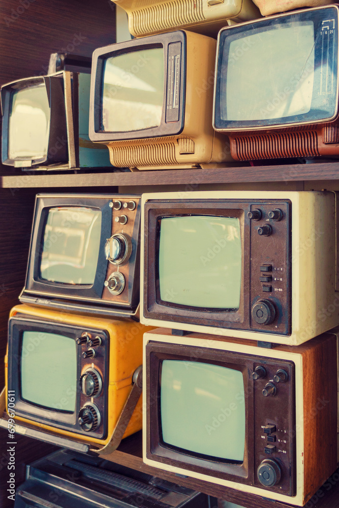 Many retro television. vintage old TV is colorful multi-row. Seeing the ...