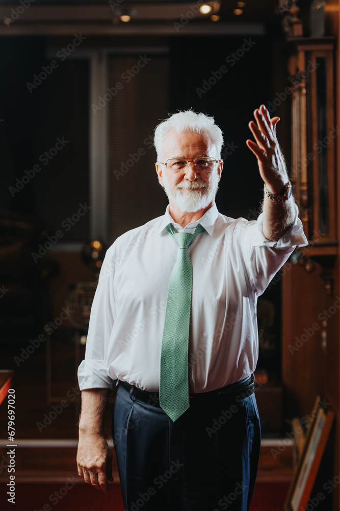 Confident, experienced university rector posing in a modern office. The ...