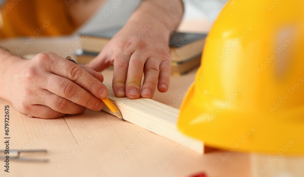 Arms of worker making structure plan on scaled paper closeup. Manual ...