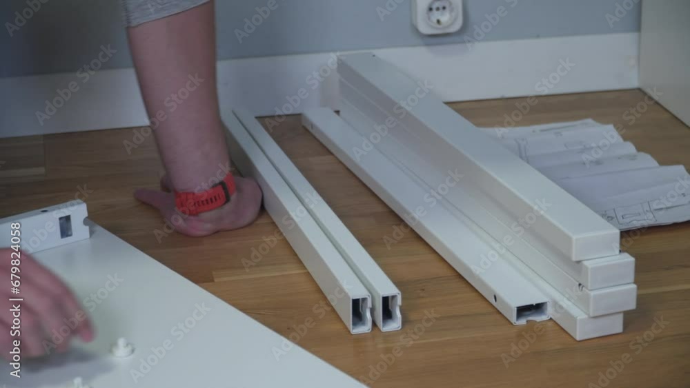 DIY white table assembly process at home. Furniture installation. New ...