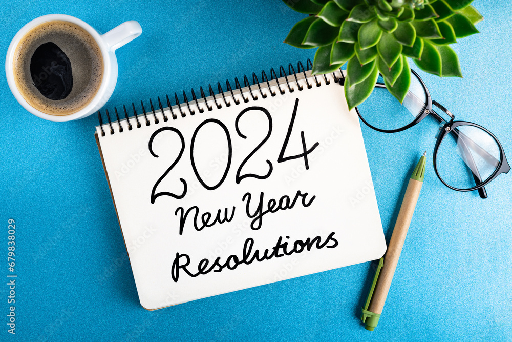 New year resolutions 2024 on desk. 2024 goals list with notebook ...