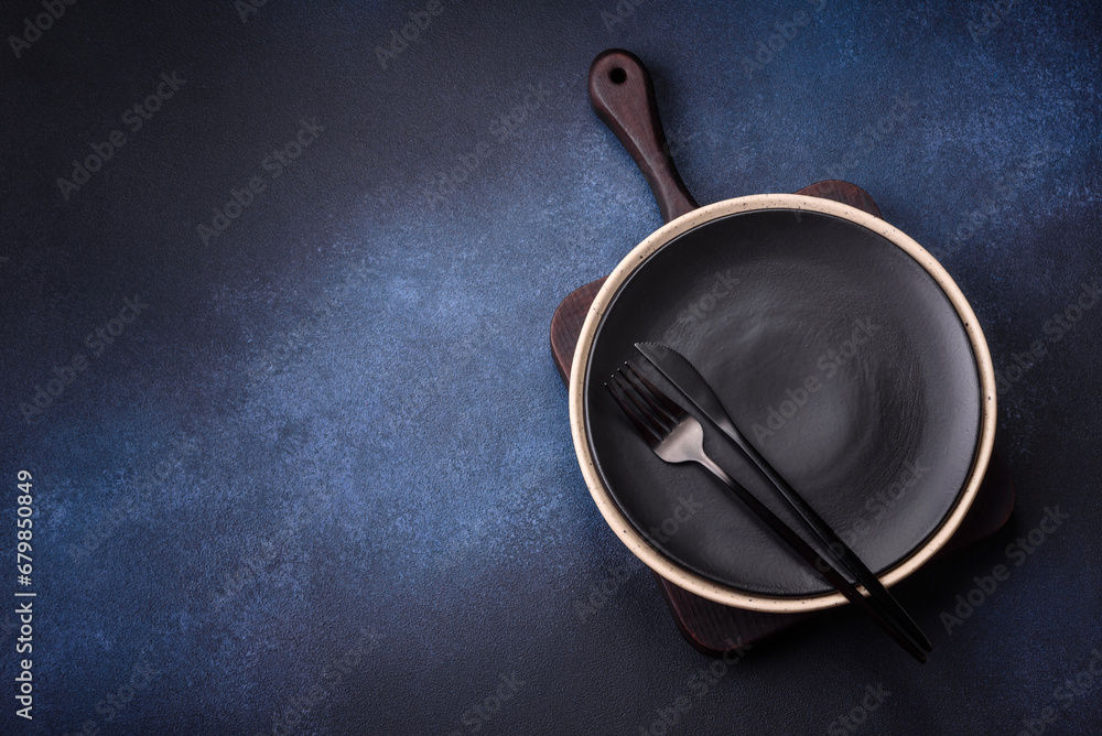 Round empty colored ceramic plate on concrete texture background Stock ...