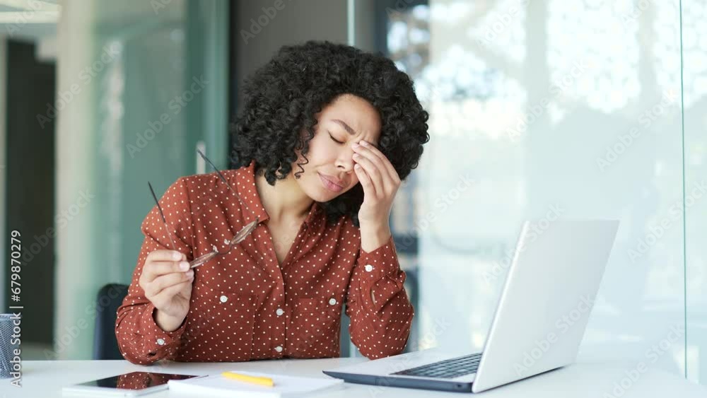 Overworked young african american female employee suffering from eye ...