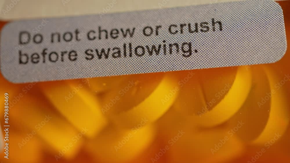 Prescription bottle with sticker text, Do not chew or crush before ...