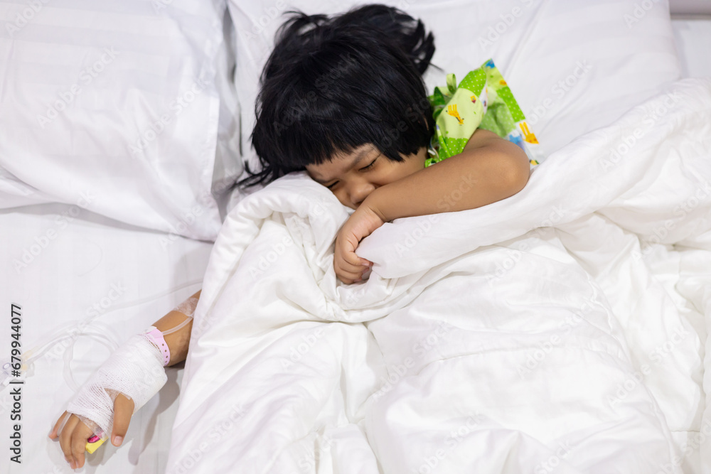 Child's hand fever patients have IV tube in hospital. Toddler girl ...