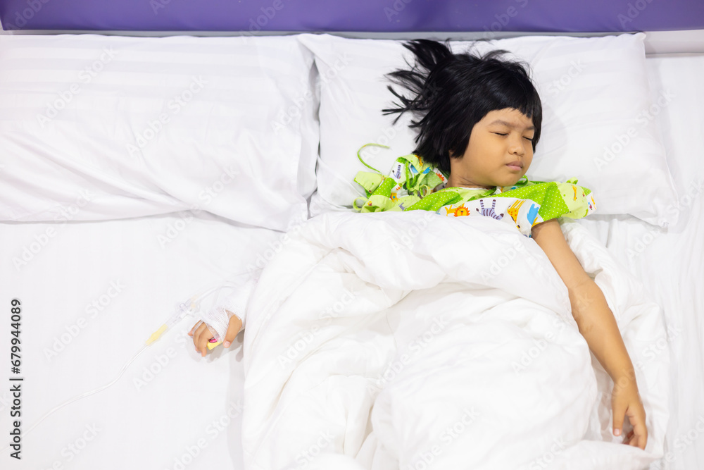 Child's hand fever patients have IV tube in hospital. Toddler girl ...