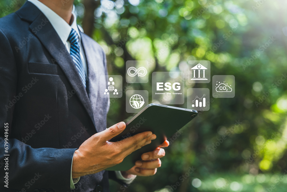 Business man using tablet to analyze ESG concept ,Sustainable ...