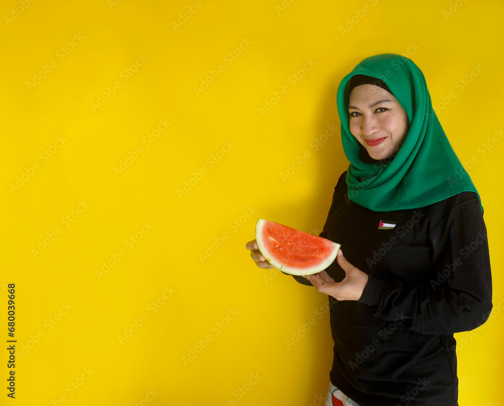 Beautiful muslim woman wearing hijab and holding watermelon fruit as a ...