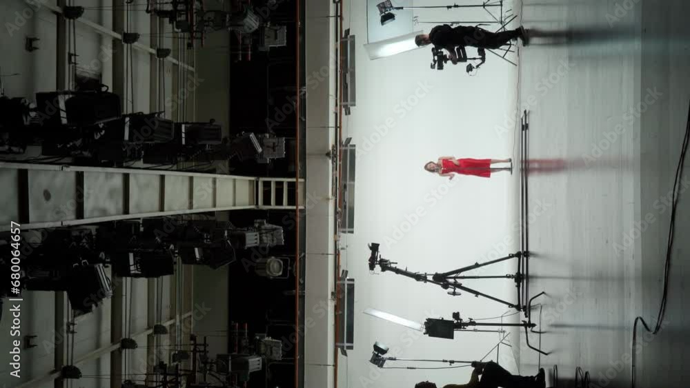 Professional filming pavilion with a white cyclorama. Shooting of a ...