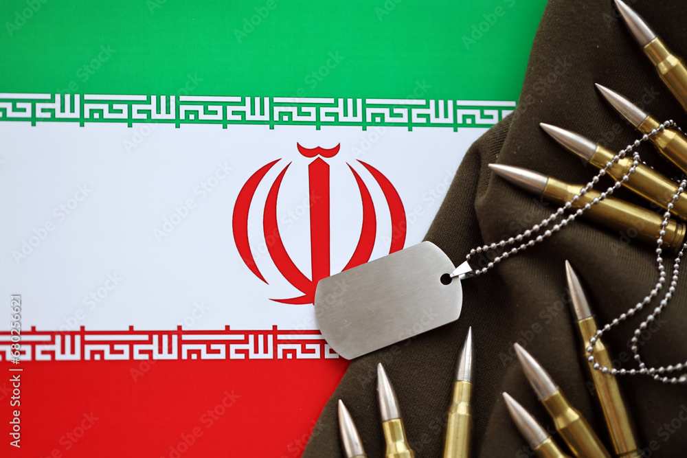 Many rifle bullets and dog tags with flag of Islamic Republic of Iran ...