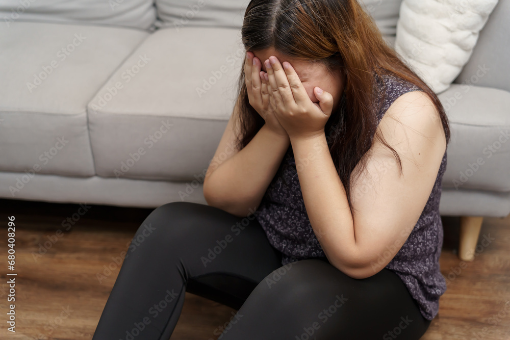 Sad Overweight plus size woman thinking about problems on sofa upset ...