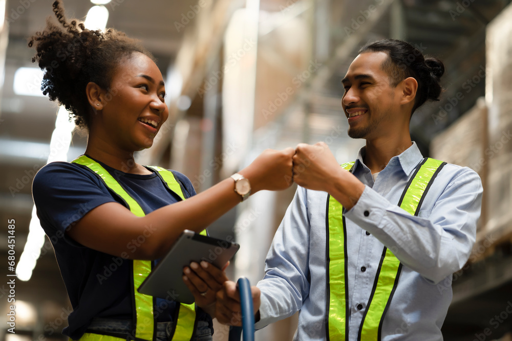 Multiethnic warehouse workers feel happiness, making hands pump ...