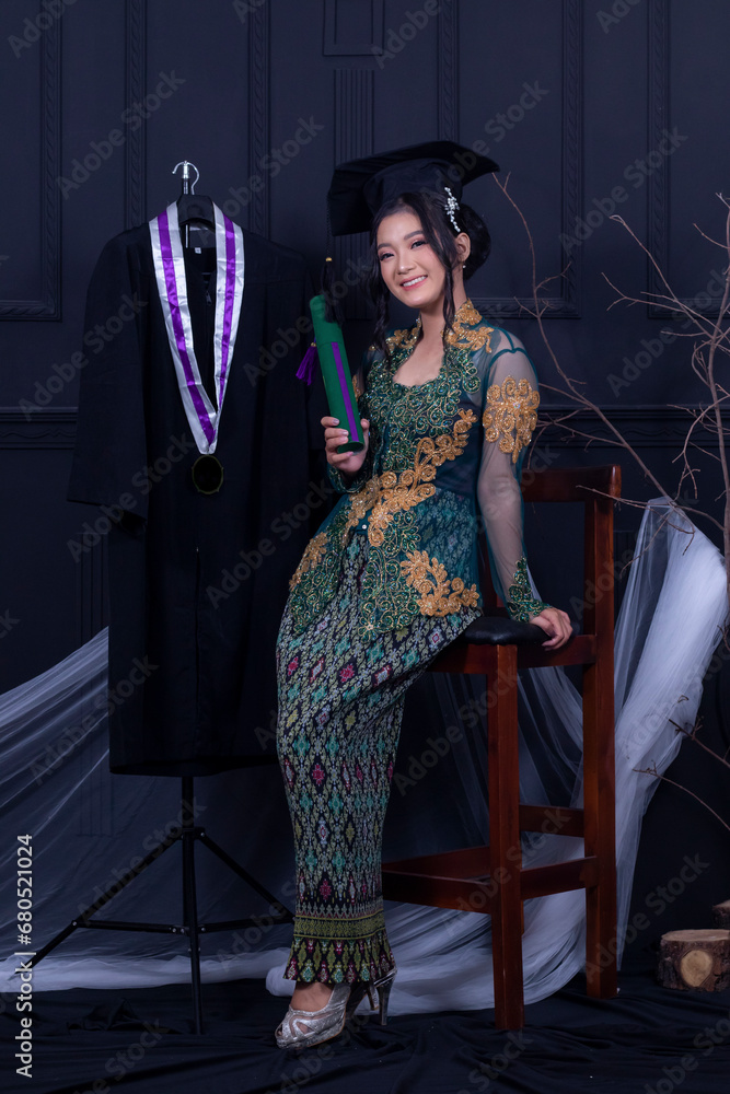 beautiful exotic Asian indonesia woman graduating smiling happily next ...