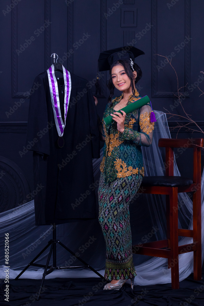 beautiful Asian indonesia woman graduating smiling happily next to ...