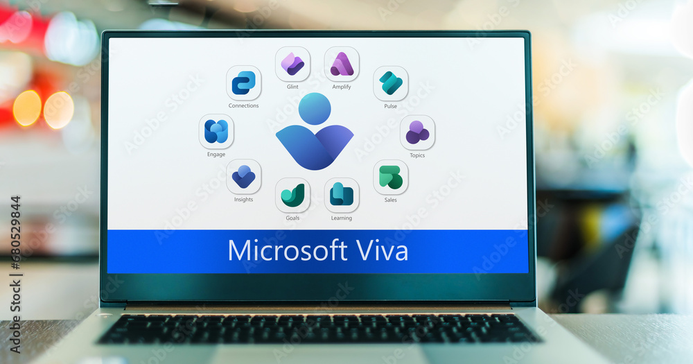 Laptop computer displaying logos of Microsoft Viva Stock Photo | Adobe ...