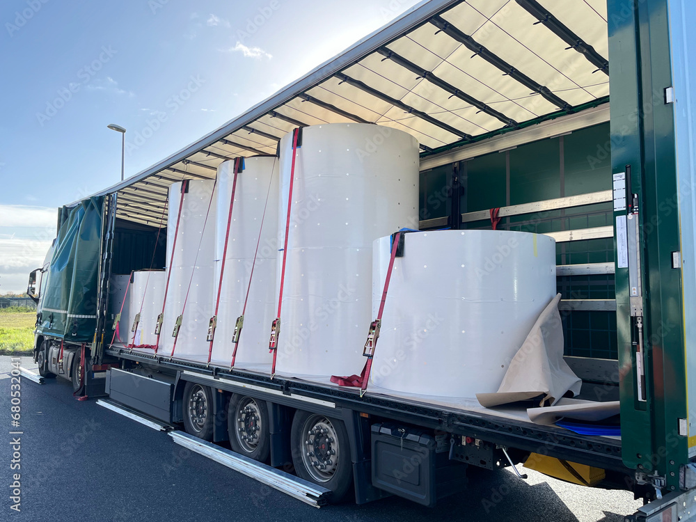 Loading, transporting and unloading large rolls of paper in a semi ...