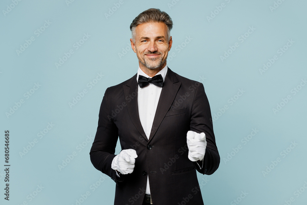 Adult smiling barista male waiter butler man wear shirt black suit bow ...