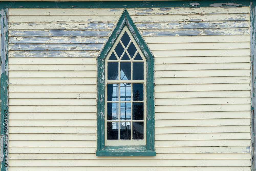 The exterior wall of a religious building with pale yellow colored ...
